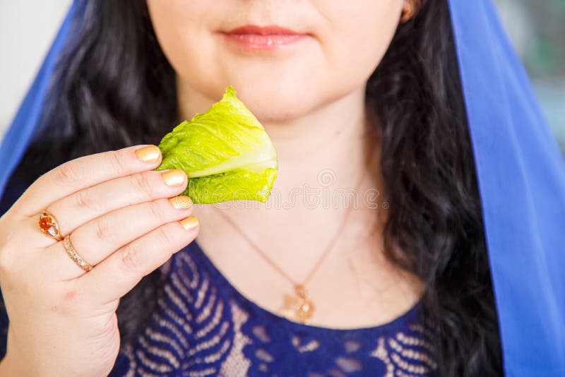 Maror in the Hands of the Woman Who she Eats. Stock Image - Image of ...