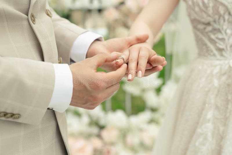 A Married Couple Exchanges Wedding Rings at a Wedding Ceremony. Stock ...