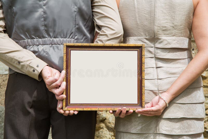 Married Couple Holding Advertising or Message Board in Hands. Stock ...