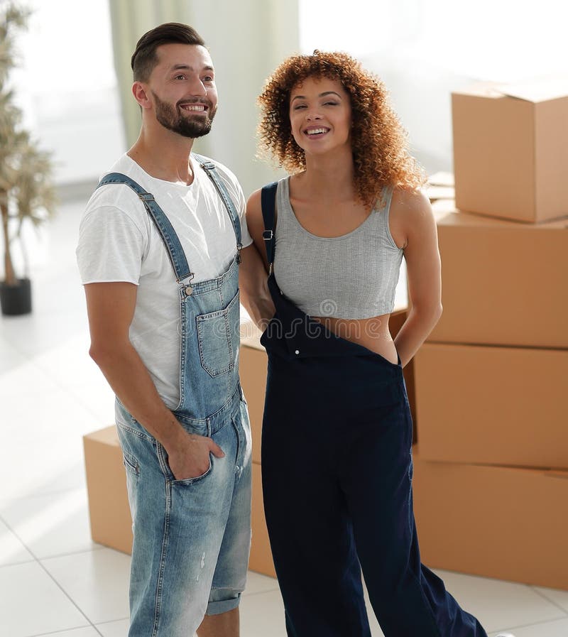 Married Couple Standing in New Apartment Stock Image - Image of ...