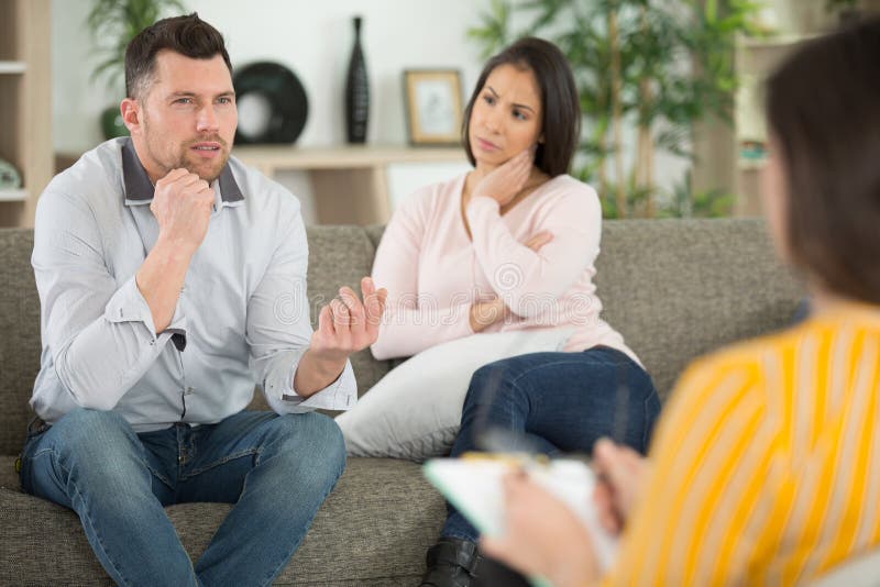 Married Couple Talking while Sitting on Therapy Session Stock Image ...