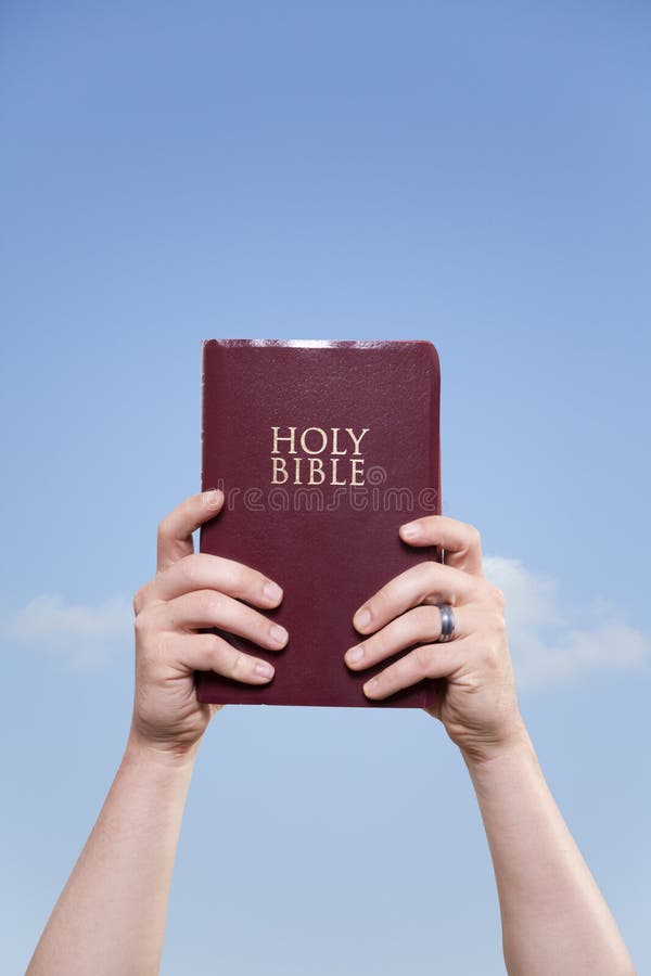 Holding Holy Bible stock image. Image of faith, human - 16928431