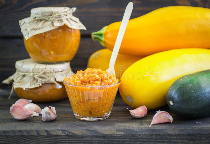 Marrow Paste in Banks and in a Bowl, Garlic, and Zucchini Stock Photo ...