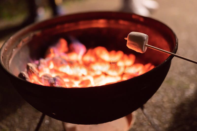 Marshmallow on a Stick Being Roasted Stock Photo - Image of roasted ...