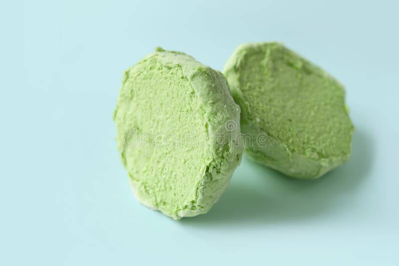 Marshmallows on Blue. Green Divided Marshmallow on a Blue Background ...