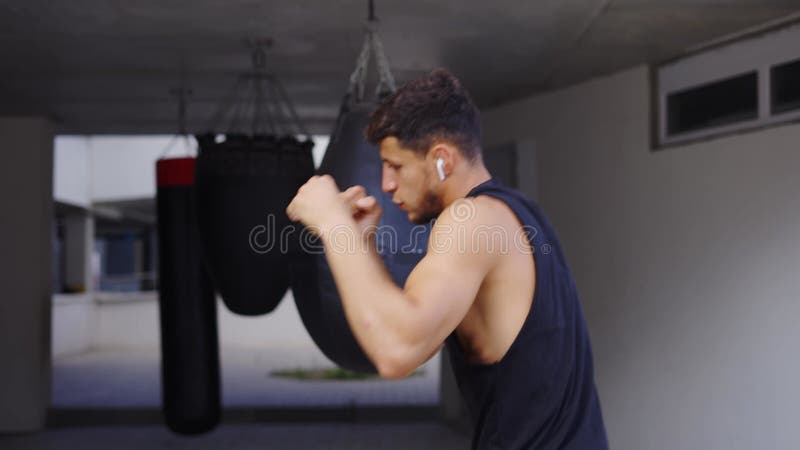 Martial Art Fighter Does Shadow Boxing, Kickboxer Training Strikes in ...