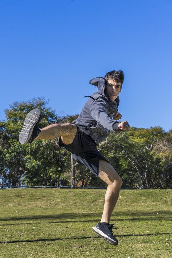 Martial Fighter Practicing Flying Kicks. Copy Space Stock Photo - Image ...