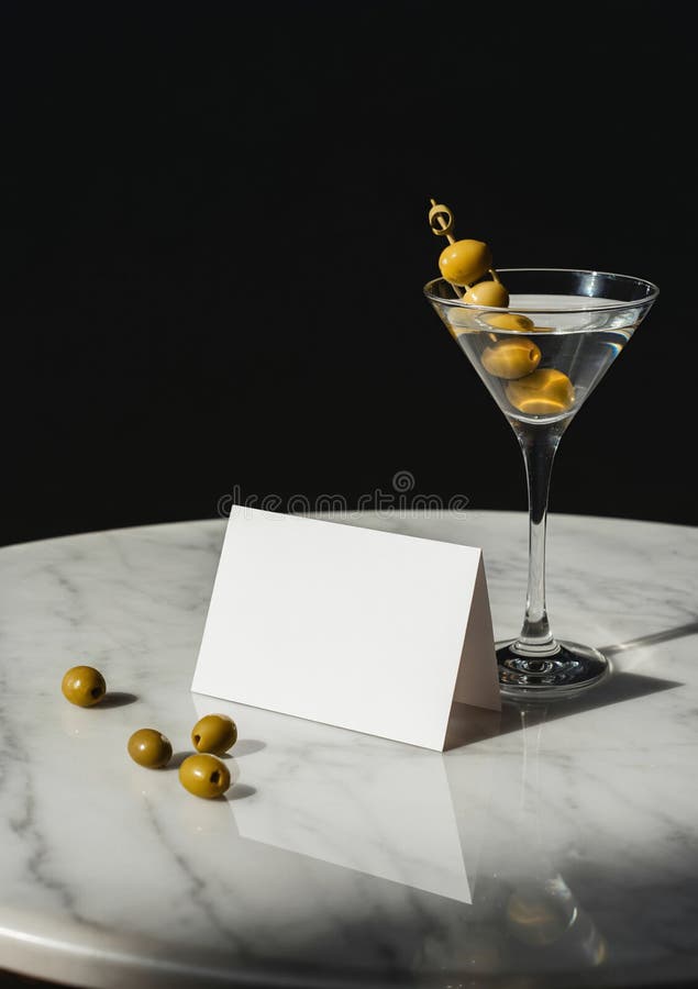 Martini Cocktail with Olives and Blank Card on White Marble Table Stock ...