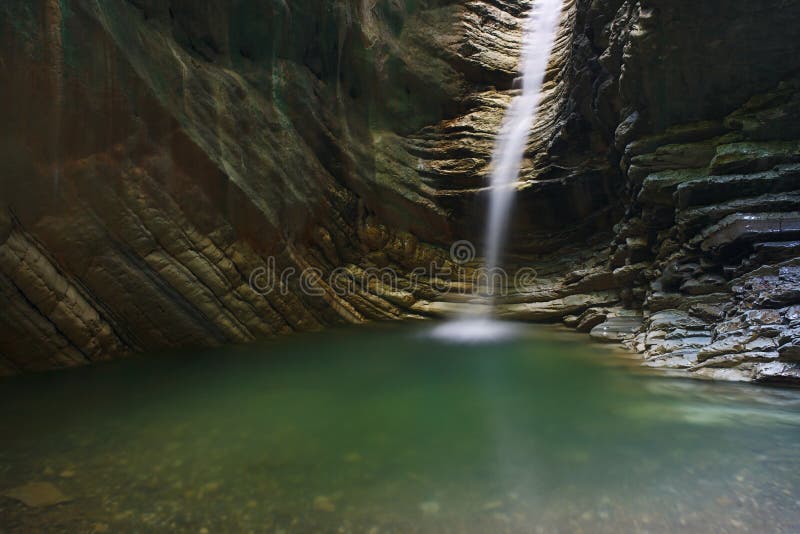 Marvellous Grotto with Flowing Beautiful Waterfall Stock Image - Image ...