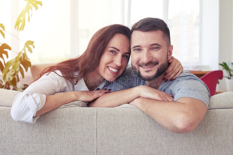 Marvelous Lady and Sir Hugging and Relaxing on Sofa Stock Photo - Image ...