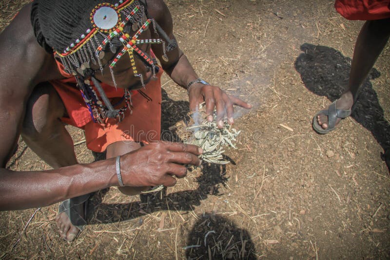 Masai men making fire editorial stock image. Image of masai - 28279734