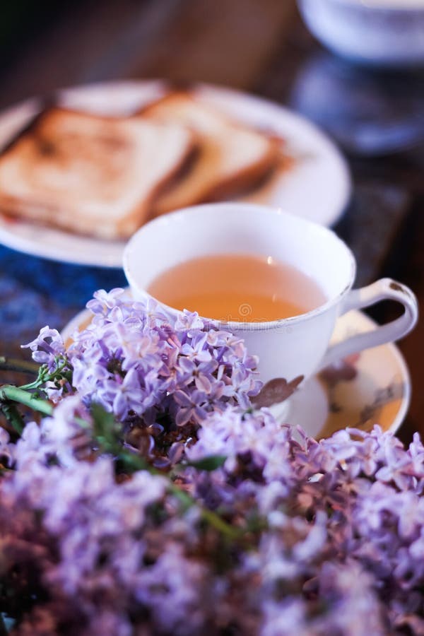 Masala Chai Tea of India with Bread, Butter and Lilac Flower Stock ...
