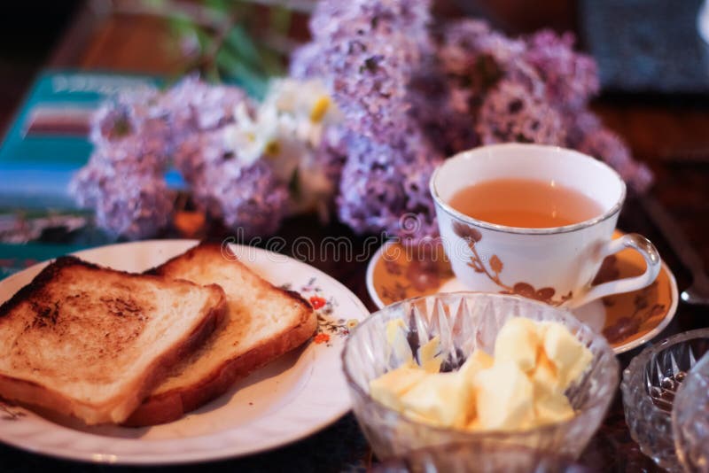 Masala Chai Tea of India with Bread, Butter and Lilac Flower Stock ...