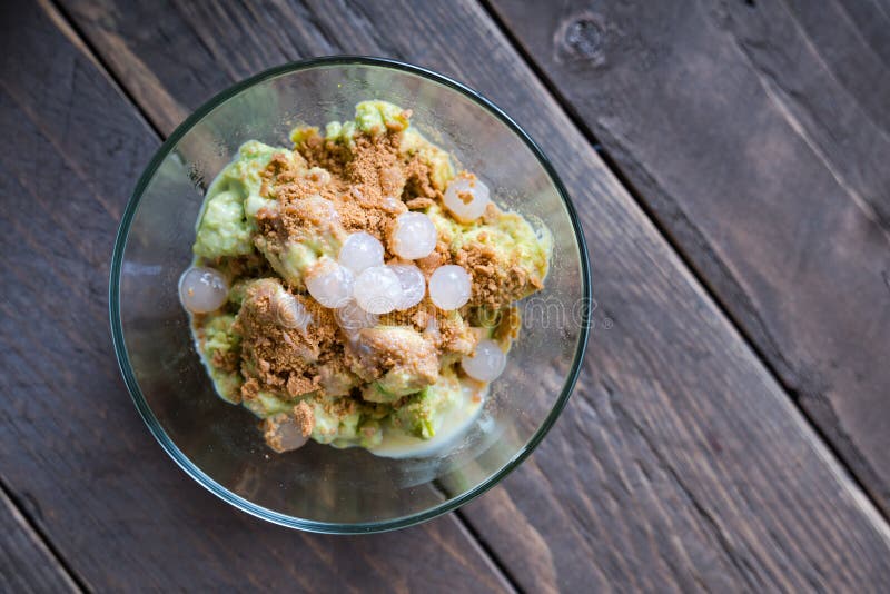Mashed Avocado with Tapioca Pearls and Sweet Crashed Biscuit Stock ...