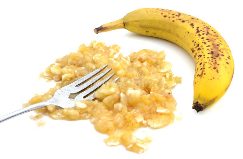 Mashed Banana with Fork and an Unpeeled Fruit Stock Photo - Image of ...