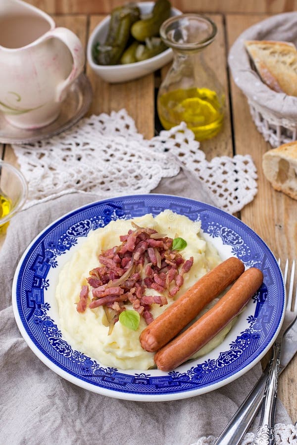 Mashed Potatoes with Apples Served with Sausages and Bacon Stock Photo ...