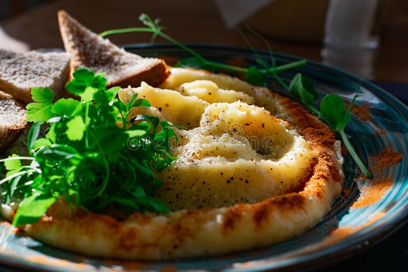 Mashed Potatoes in a Beautiful Serving with Paprika, Slices of Dark ...