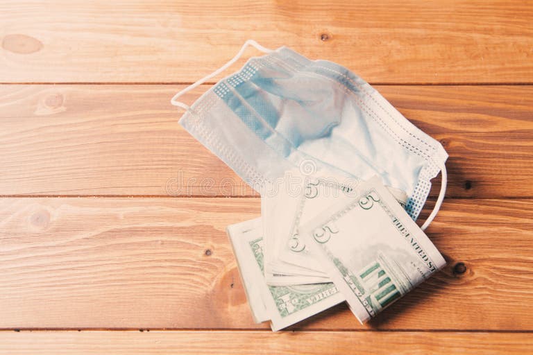 Mask and dollar bills stock photo. Image of bribing - 216704552