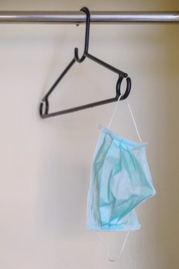 Mask hanging on a hanger stock image. Image of wardrobe - 181660653