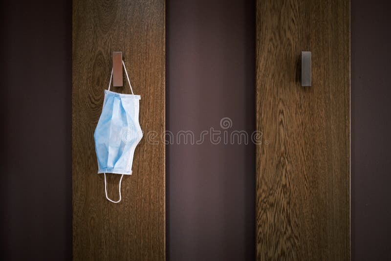 Mask Hanging from a Wooden Hanger on the Wall Stock Photo - Image of ...