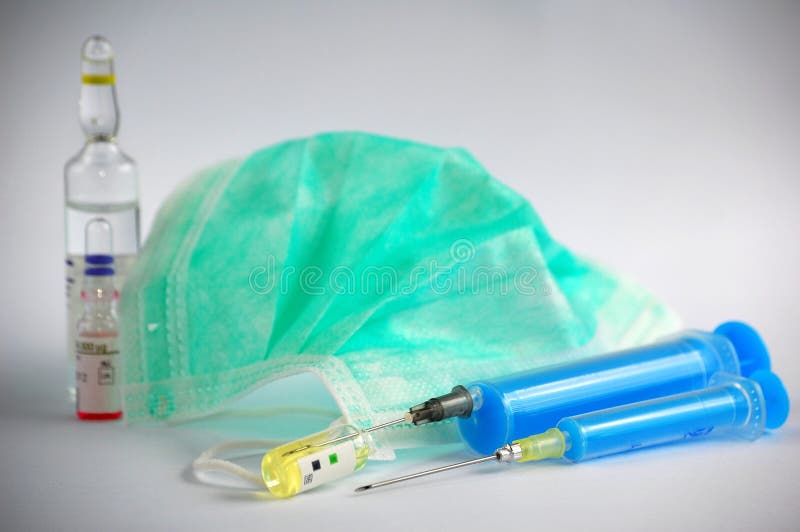 Surgical mask and syringe stock image. Image of surgical - 10831349