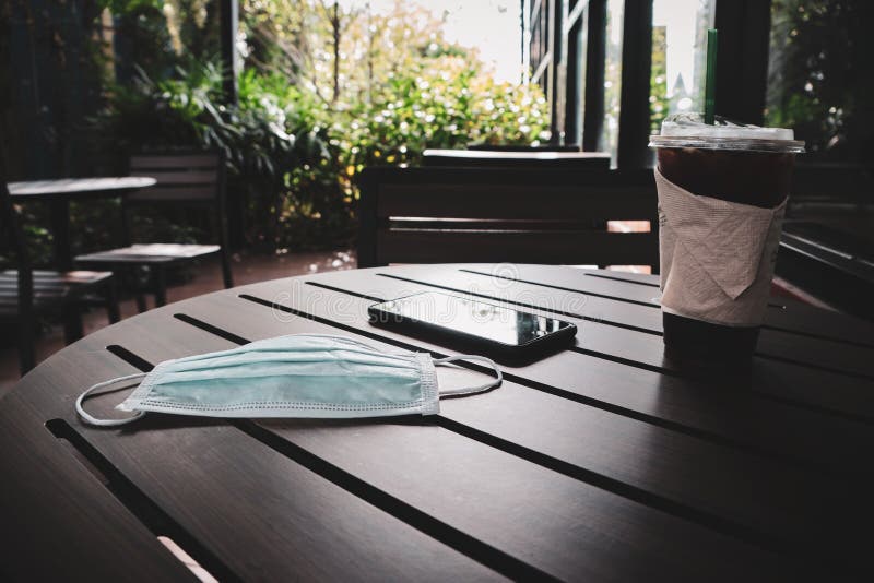 Mask on Table in Coffee Shop Stock Image - Image of epidemic, table ...