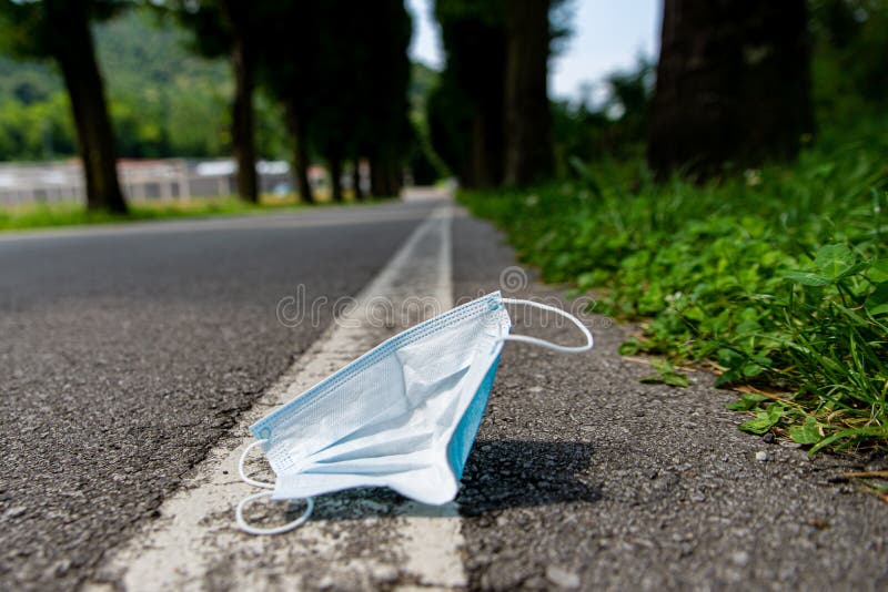Mask thrown on the street stock photo. Image of coronavirus - 188519582