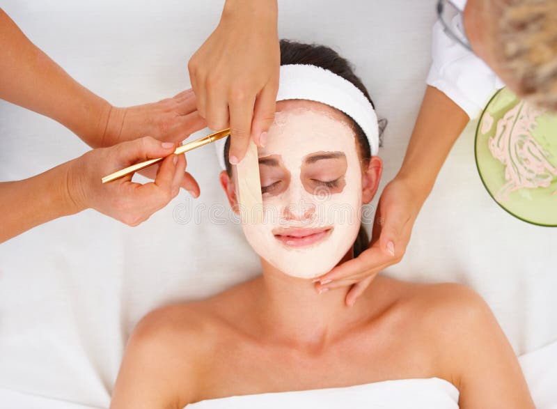 Mask Treatment Being Applied on a Young Woman Stock Photo - Image of ...