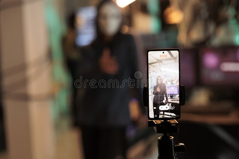 Masked Hacker Broadcasting Live Video To Ask for Ransom Stock Photo ...