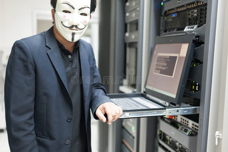 Masked Hacker in Computer Server Room Concept . Editorial Photography ...