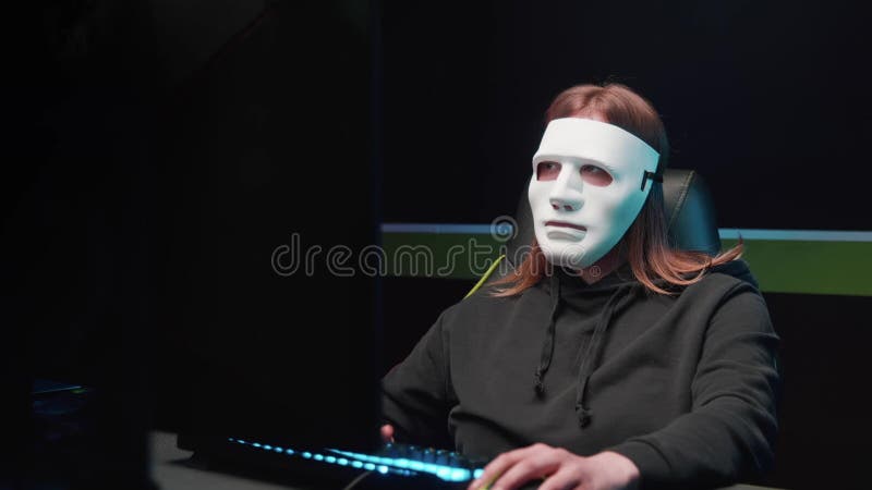 A Masked Hacker Girl Hacks A Database On A Computer Hacking It In A 5683