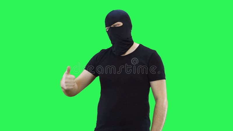 The Masked Man is Showing Thumb Up.Balaclava.Green Screen Background ...