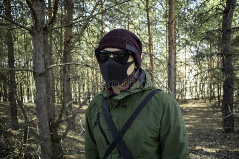 The Masked Man. a Man in the Woods. the Guy with Glasses and a Mask ...