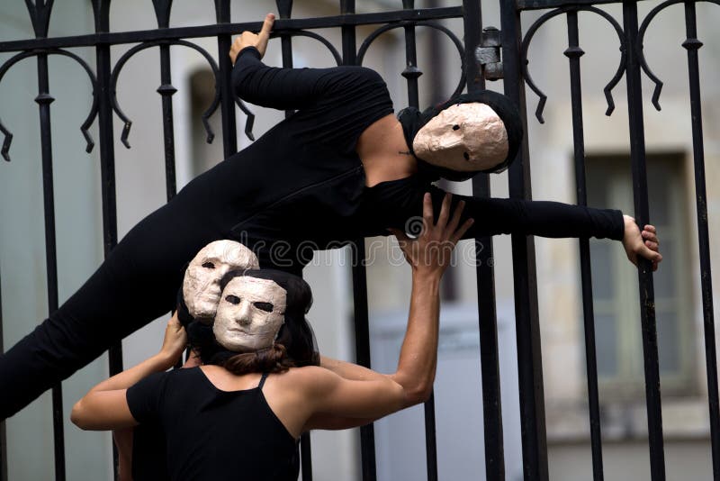 Masked people near a gate. editorial stock image. Image of france ...