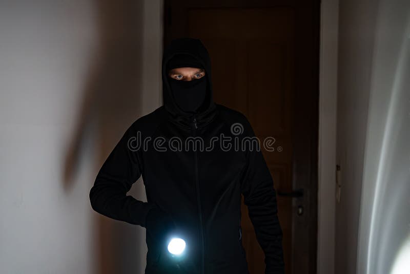 Masked Robber with Flashlight Stock Photo - Image of danger, crime ...