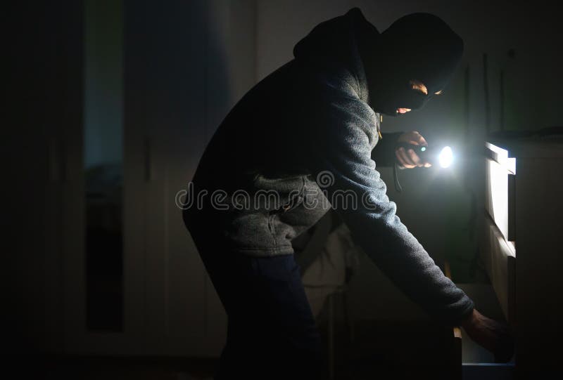 Masked Robber with Flashlight Torch Stock Photo - Image of flashlight ...