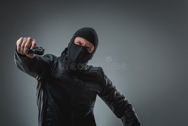 Masked Robber with Gun, Looking into the Camera. Stock Photo - Image of ...