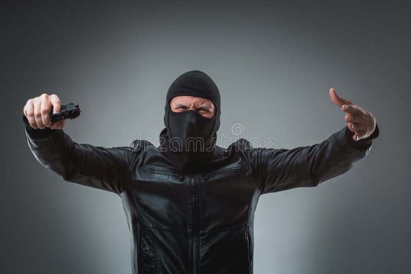 Masked Robber with Gun, Looking into the Camera. Stock Image - Image of ...