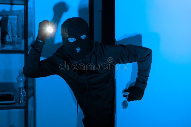 Masked Thief with Flashlight Break in Stock Photo - Image of looting ...