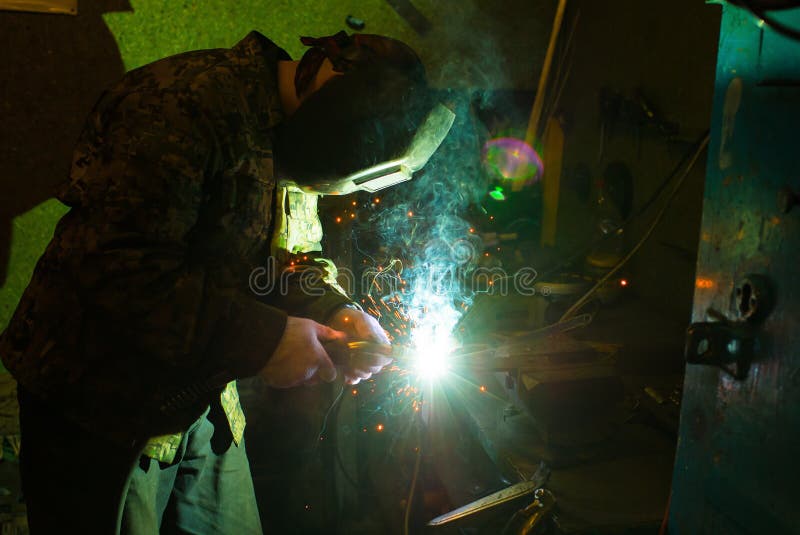 Masked Worker Doing Spot Welding Work Stock Image - Image of darkness ...