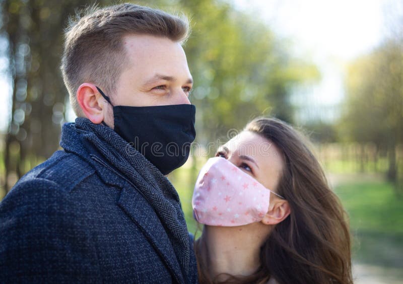 Masked Young Couple Walking In The Park Stock Image Image Of Epidemic