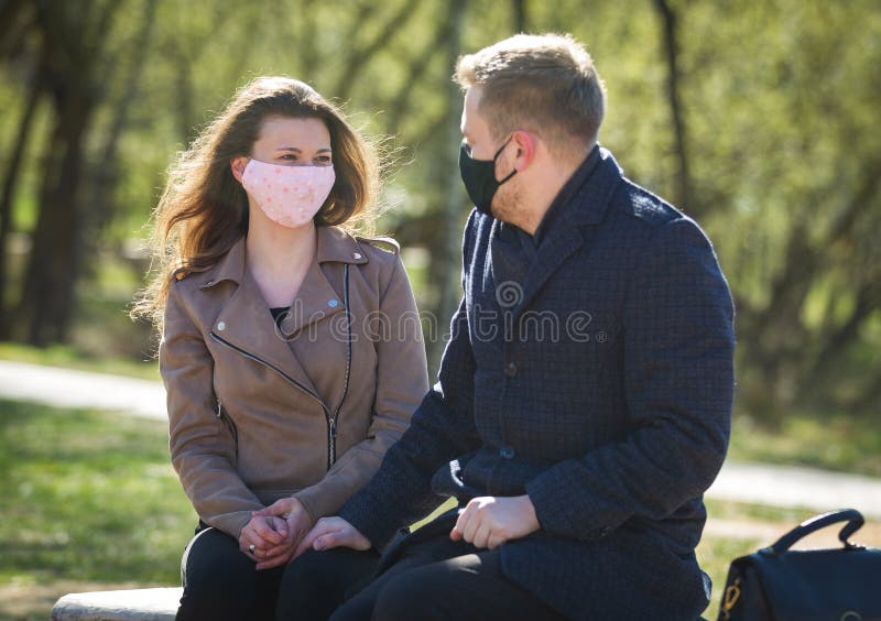 Masked Young Couple Walking In The Park Stock Image Image Of Health