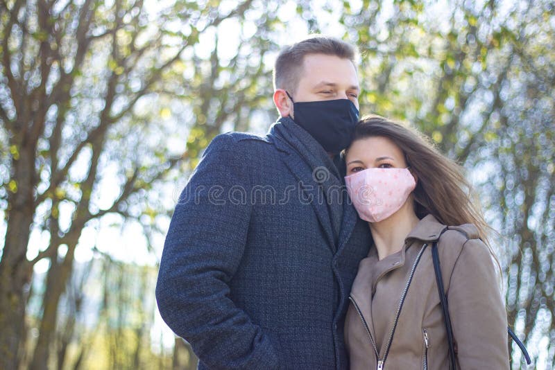 Masked Young Couple Walking In The Park Stock Image Image Of Girl
