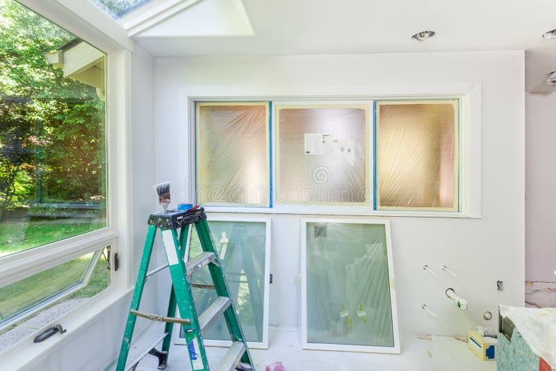 Masking and Priming Window in Kitchen Stock Image - Image of masked ...