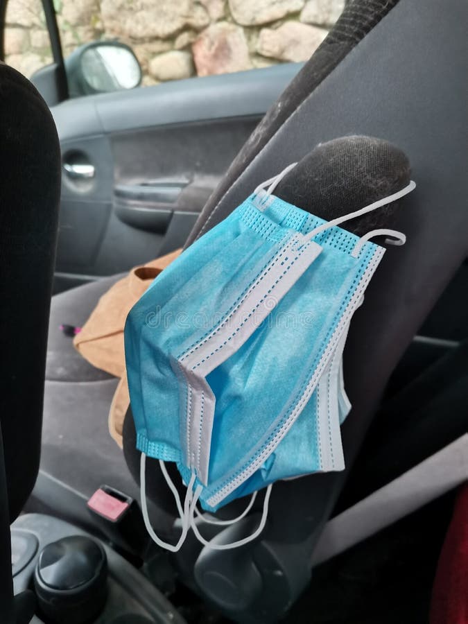 Masks in a car stock photo. Image of spread, armrest - 212482910
