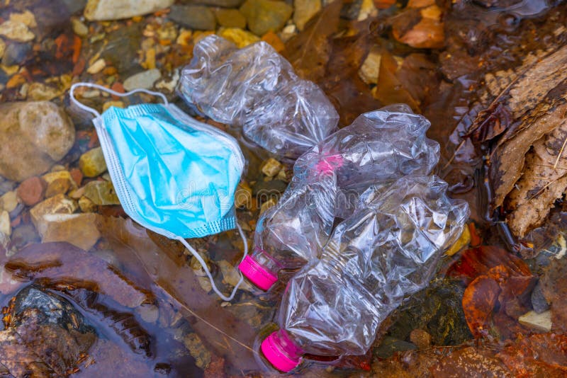 Masks and Plastic Bottles in the Water. Stock Photo - Image of mask ...