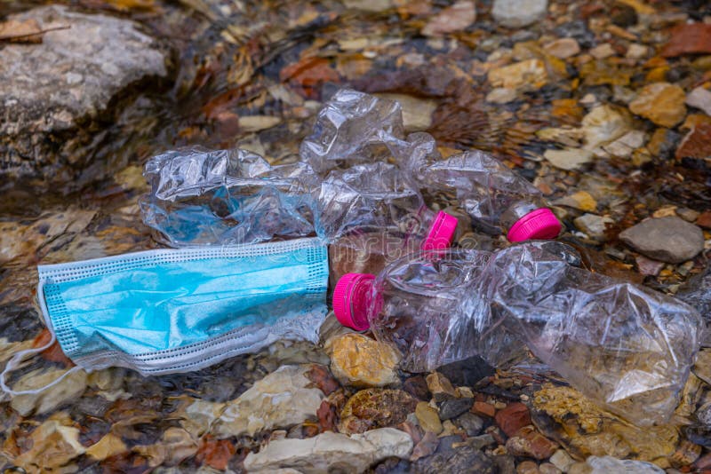 Masks and Plastic Bottles in the Water. Stock Photo - Image of ...