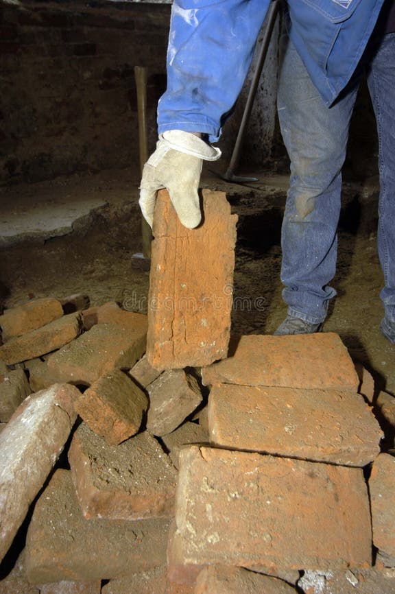 Mason builds a brick wall stock image. Image of mason - 213743921