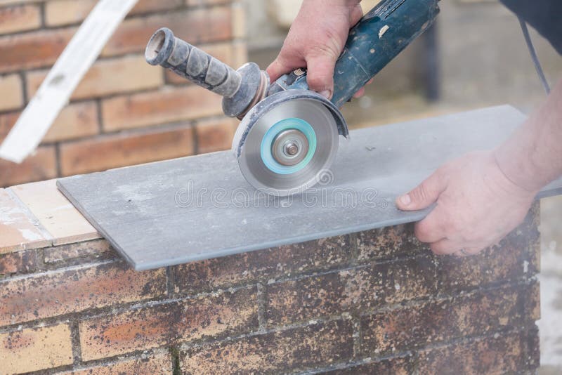 Mason Cutting a Wall Tile with Grinder Stock Image - Image of concrete ...