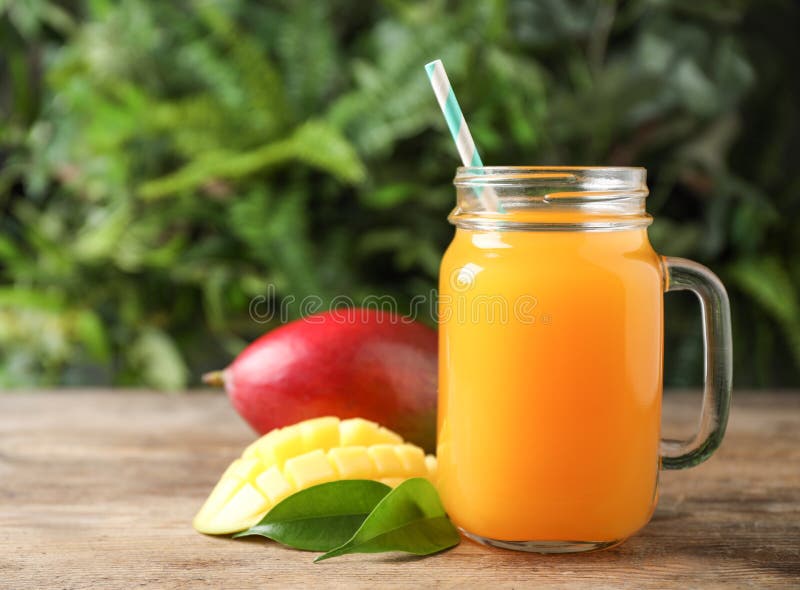 Mason Jar of Mango Drink on Wooden Table. Space for Text Stock Photo ...